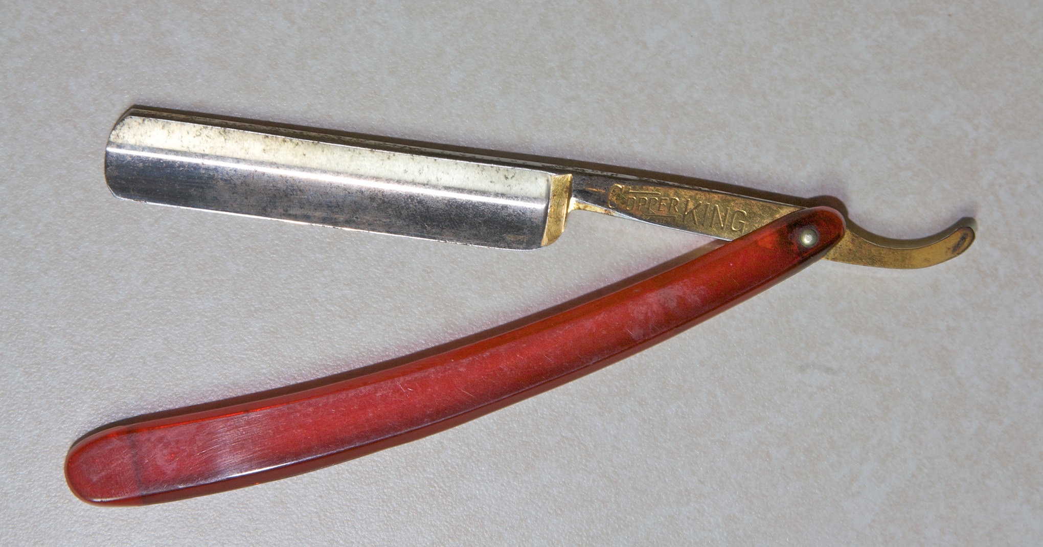 Shaving Options, by Anonymous. A butterfly double-edged razor.